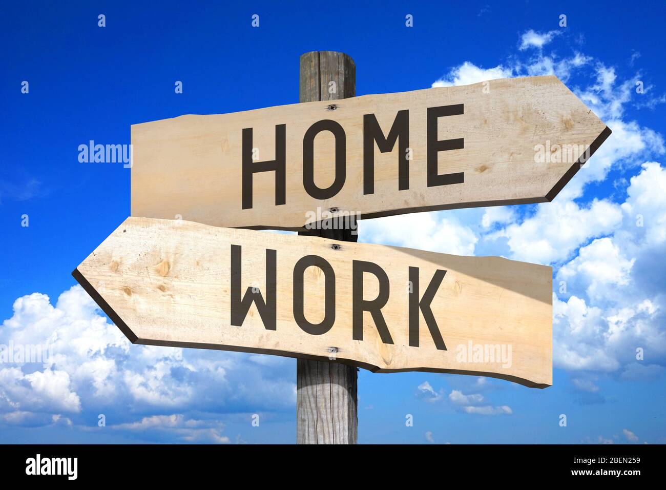 Wooden signpost with two arrows, sky Stock Photo - Alamy