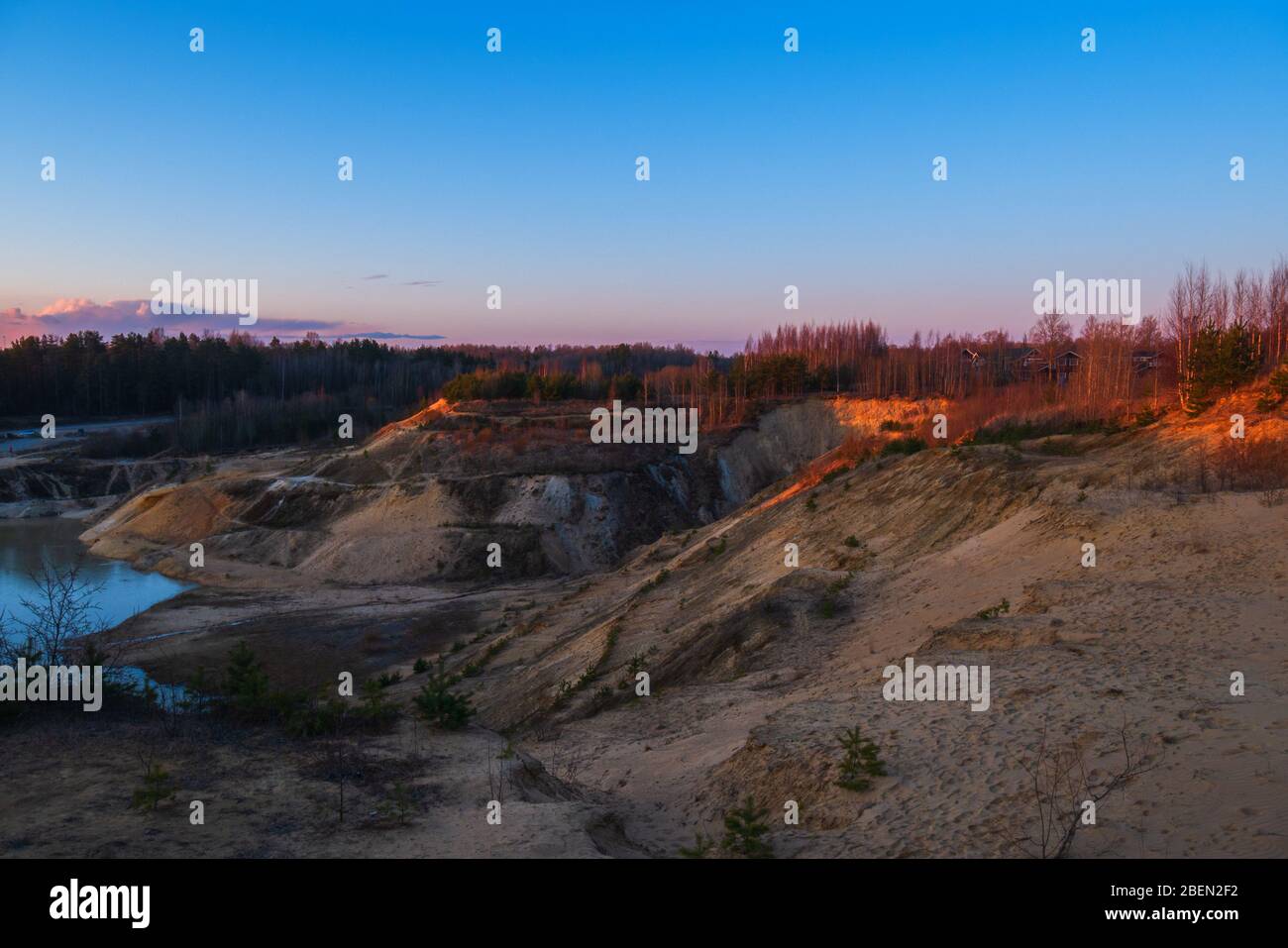 Trees and a lake in an old sandy quarry Stock Photo - Alamy