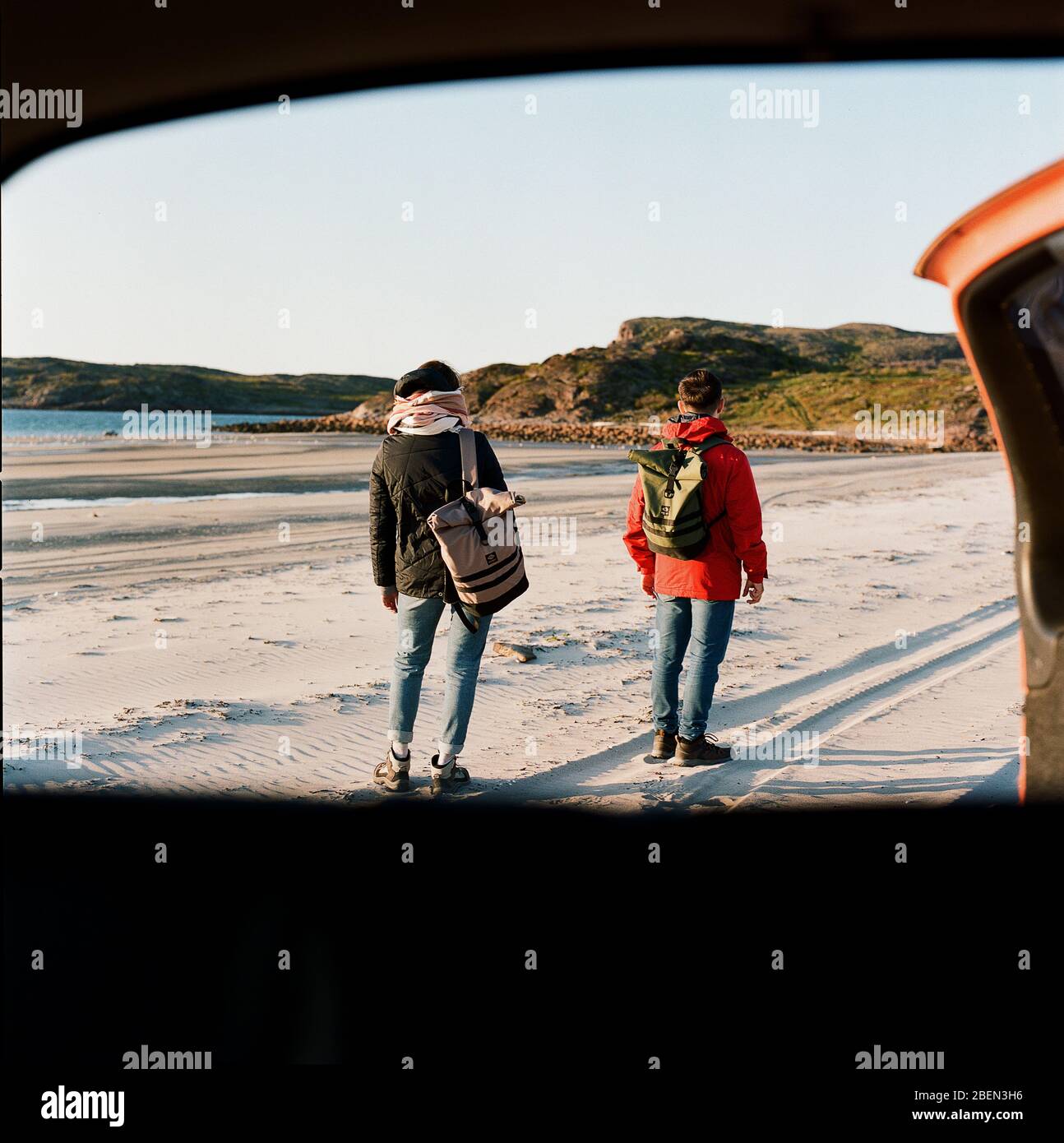 Man and woman stand on the seashore Stock Photo - Alamy