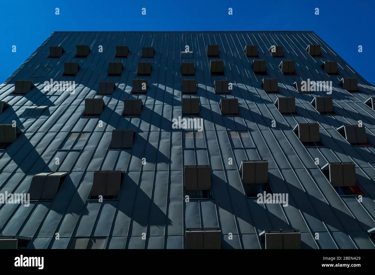 Open windows and shadows on this modern facade Stock Photo - Alamy