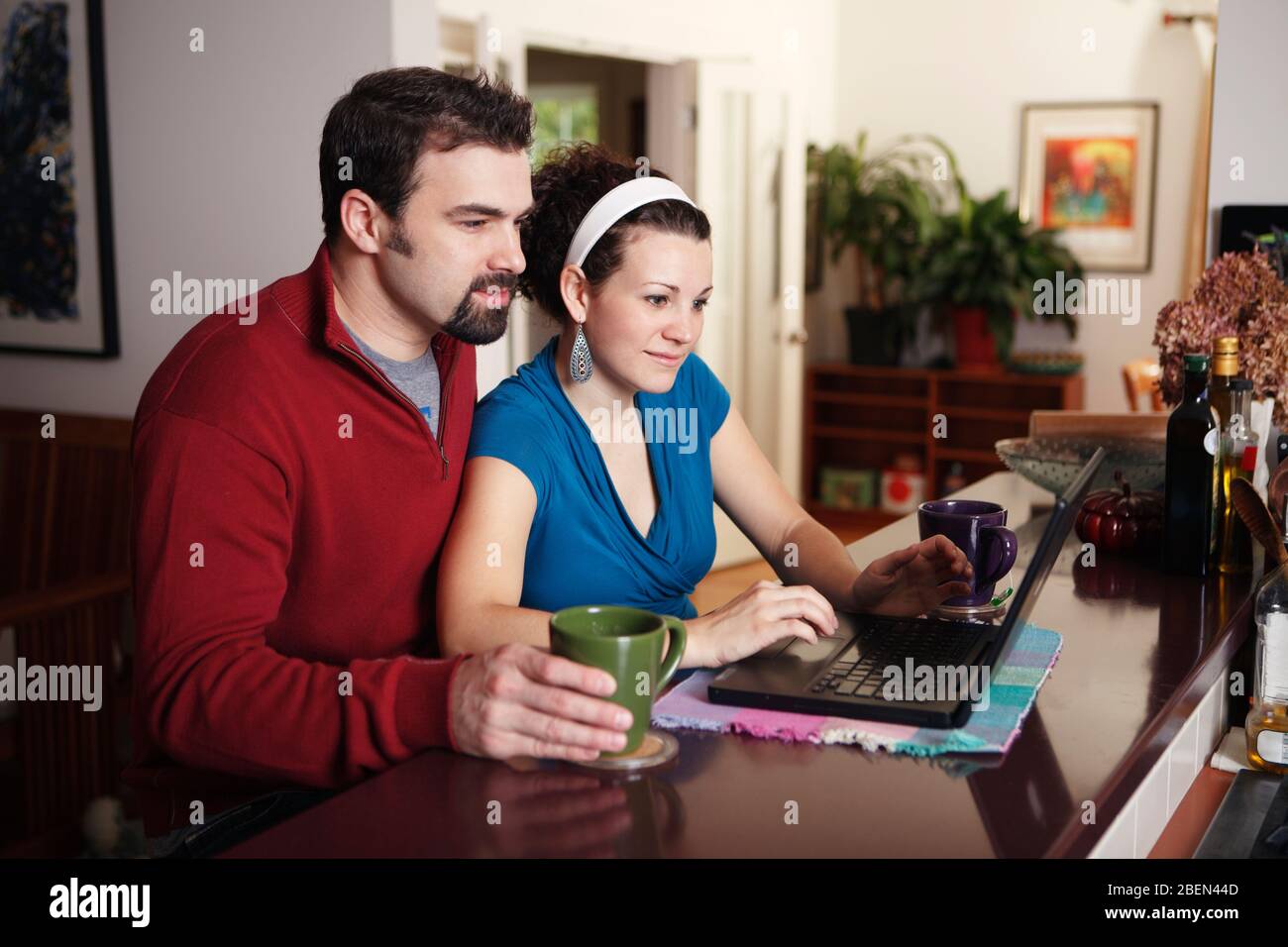 Home couple work laptop hi-res stock photography and images - Alamy