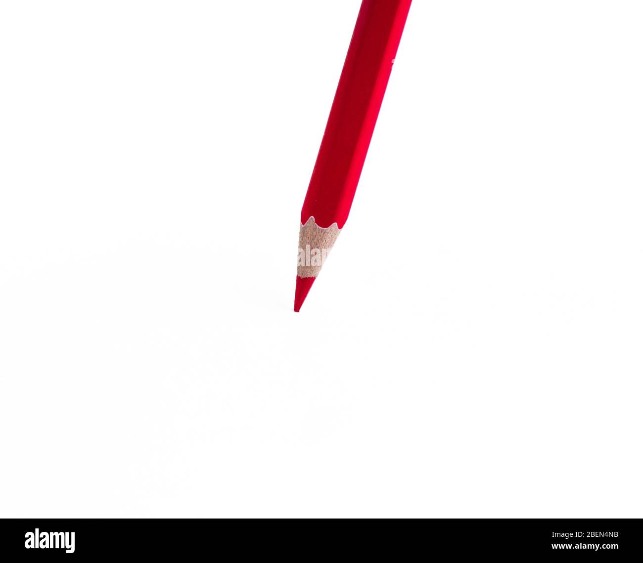 Portrait of one single red colored wood pencil crayon placed on an ...