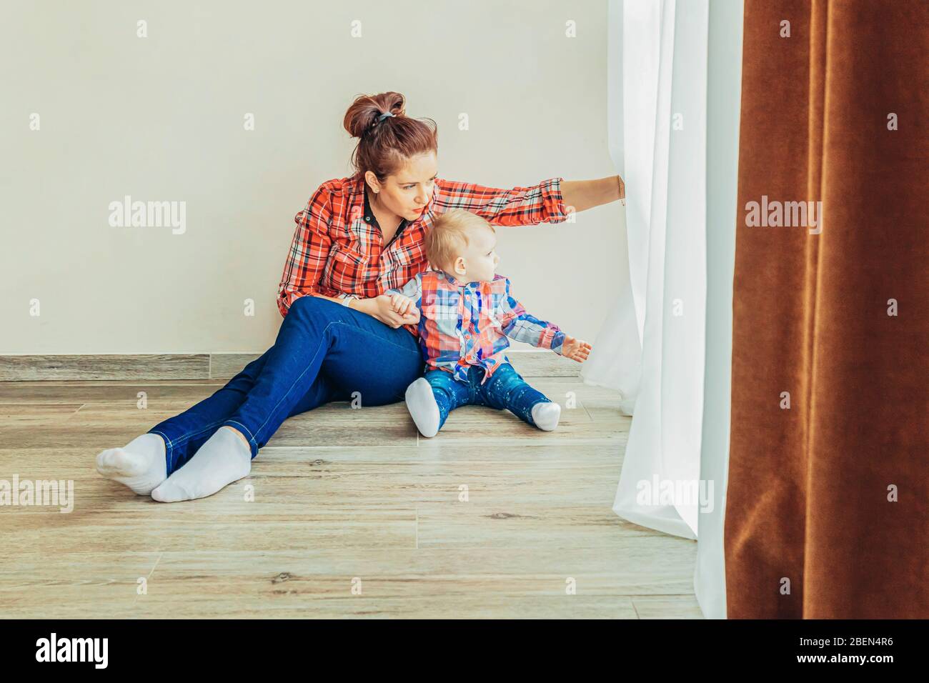 Stay Home Stay Safe. Young mother holding her child. Woman and infant ...