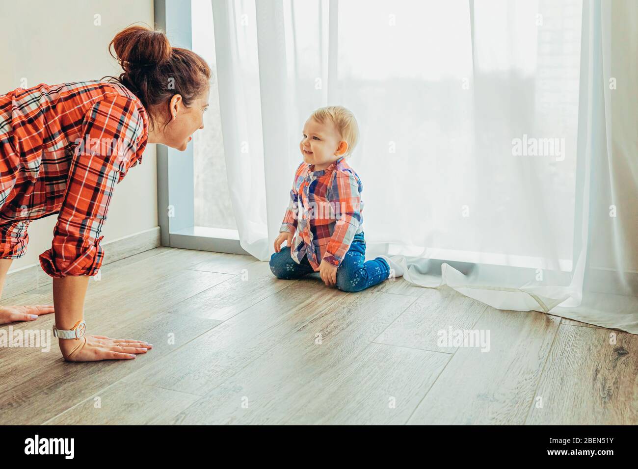 Stay Home Stay Safe. Young mother holding her child. Woman and infant ...