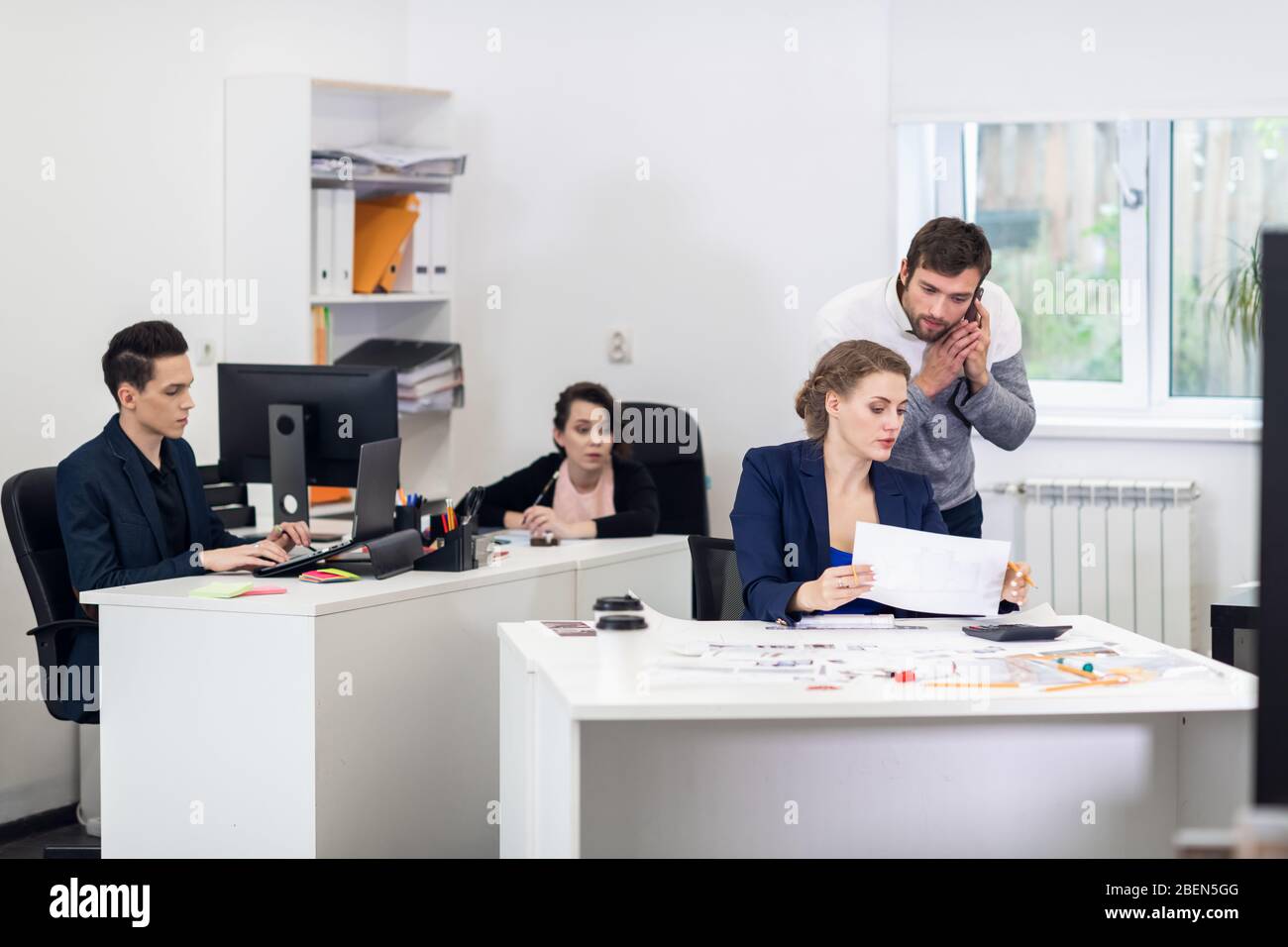 Office workers busy with their tasks, daily office routine Stock Photo ...