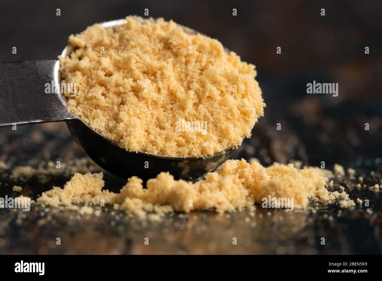 Ground Yellow Mustard Spilled from a Teaspoon Stock Photo - Alamy