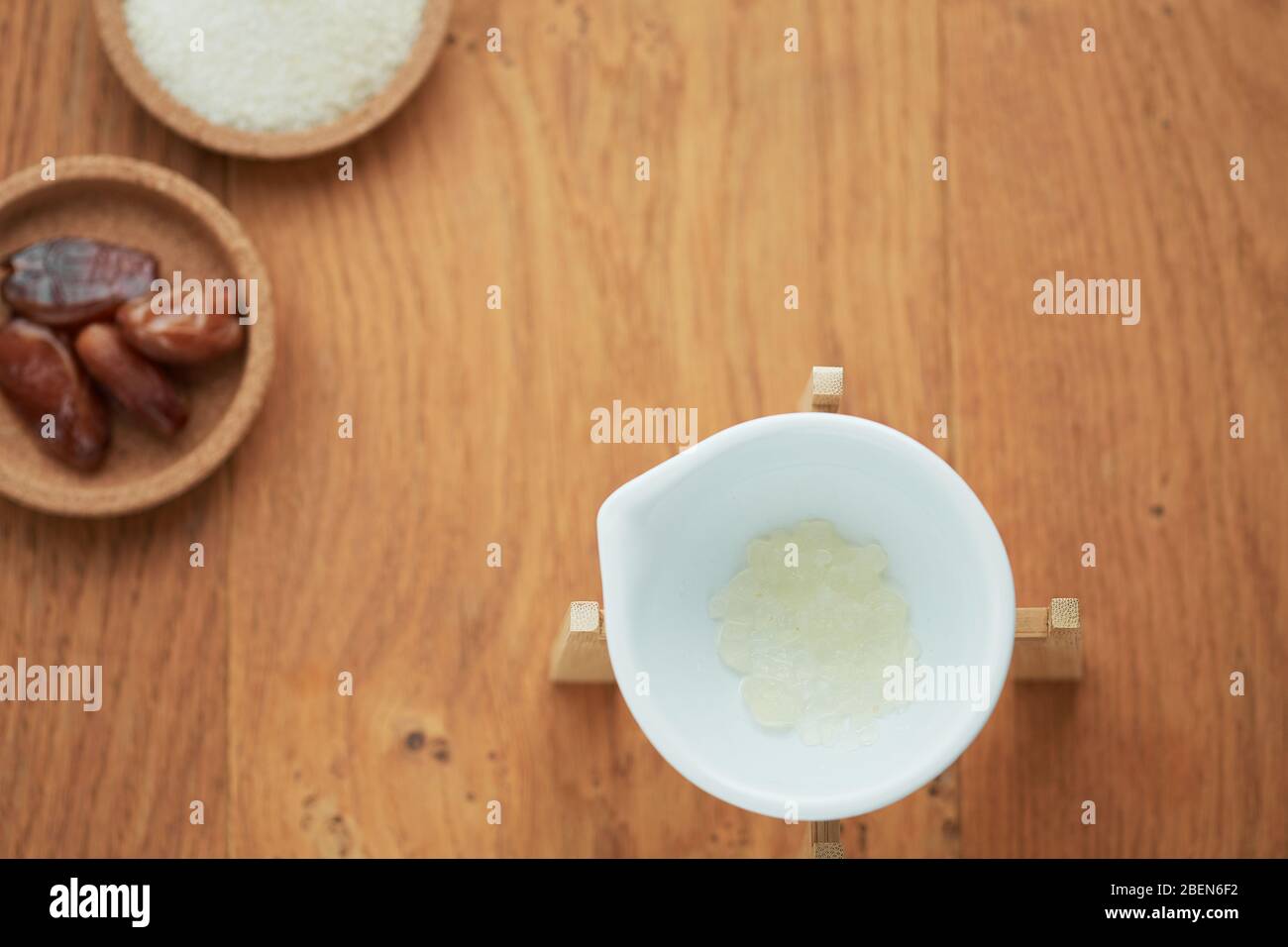 A flatlay overhead shot of the ingredients of water kefir or tibicos ...