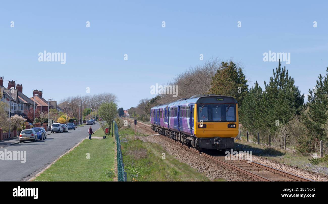 Northern rail class 142 pacer train 142068 + class 150 150210 passing Ansdell on the single ...