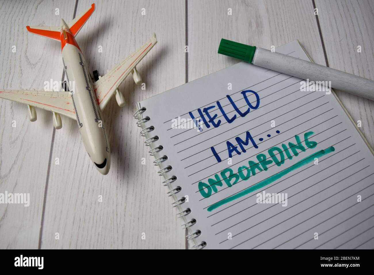 Hello I am Onboarding write on a book isolated on Office Desk Stock ...