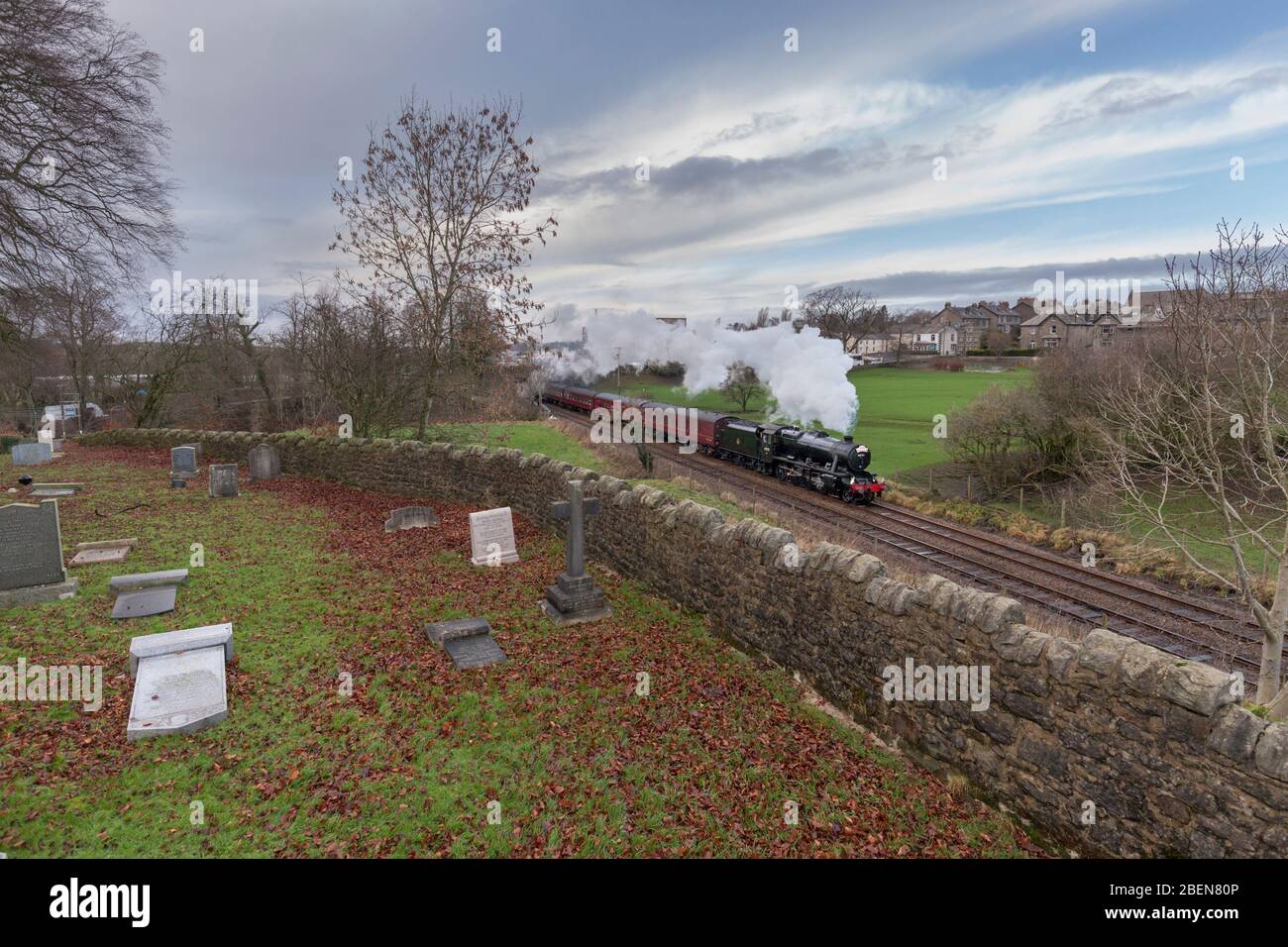 West Coast Railways 8F steam locomotive passing the graveyard at ...