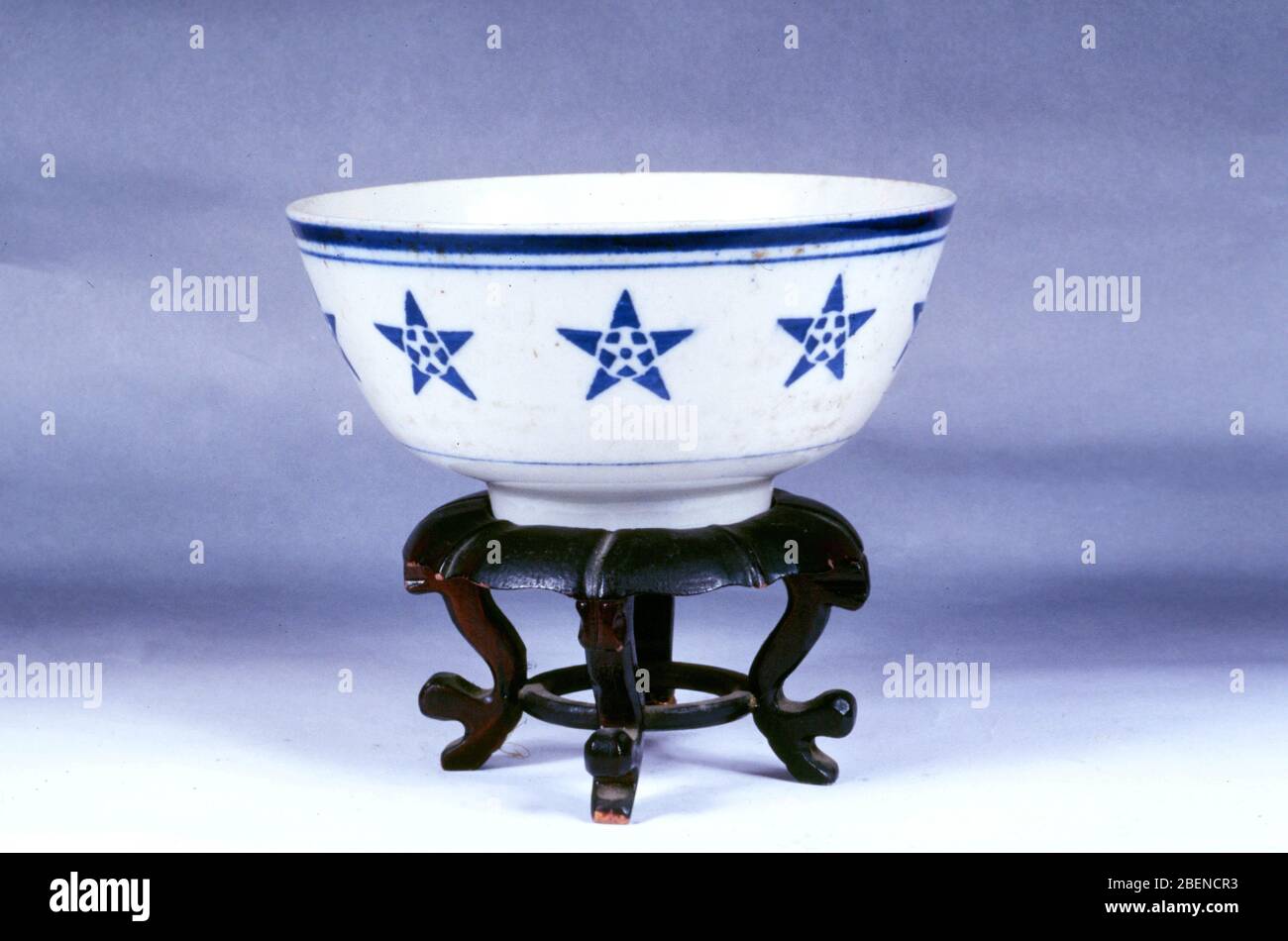 This bowl of blue and white paints nine five-pointed stars and each ...