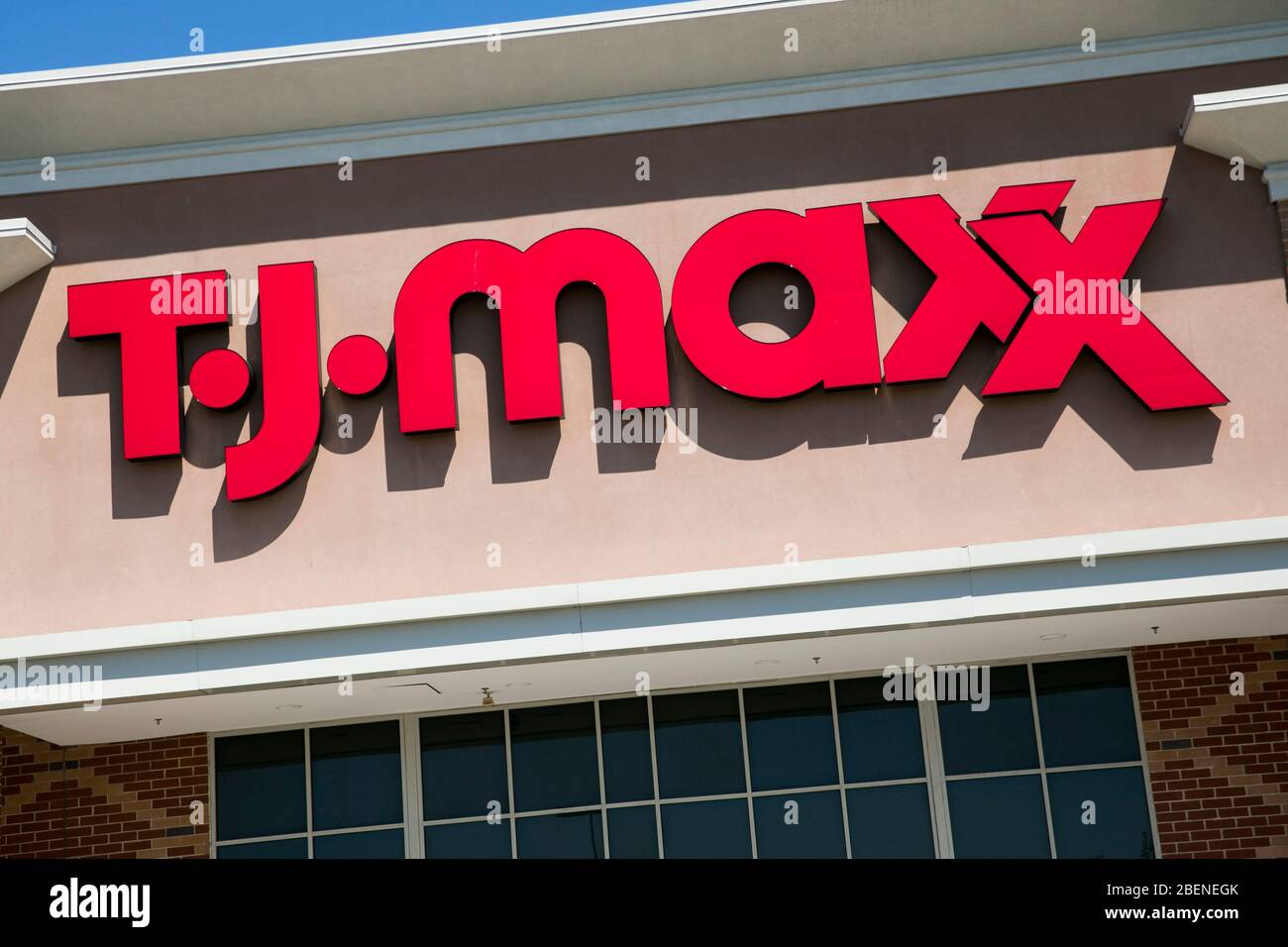 A logo sign outside of a TJ Maxx retail store location in Stafford ...