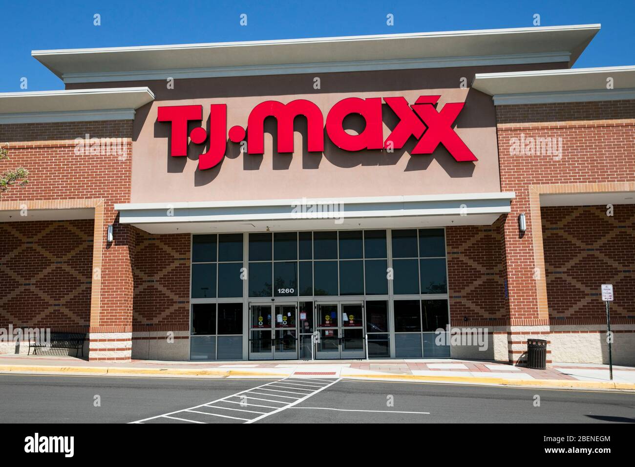 A logo sign outside of a TJ Maxx retail store location in Stafford ...