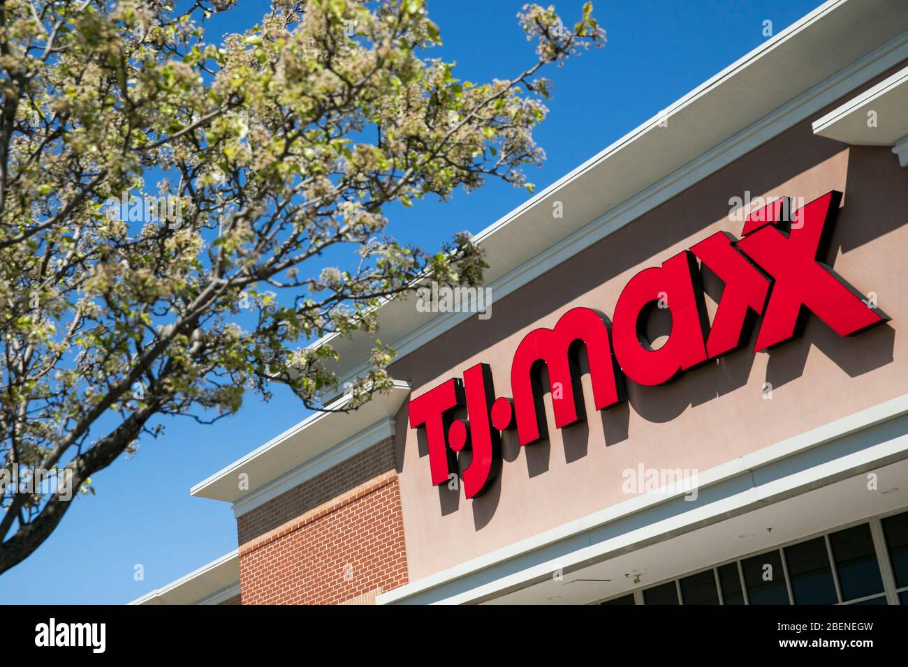 A logo sign outside of a TJ Maxx retail store location in Stafford ...