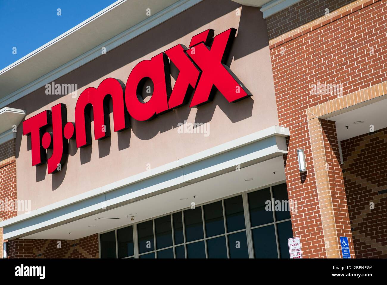A logo sign outside of a TJ Maxx retail store location in Stafford ...
