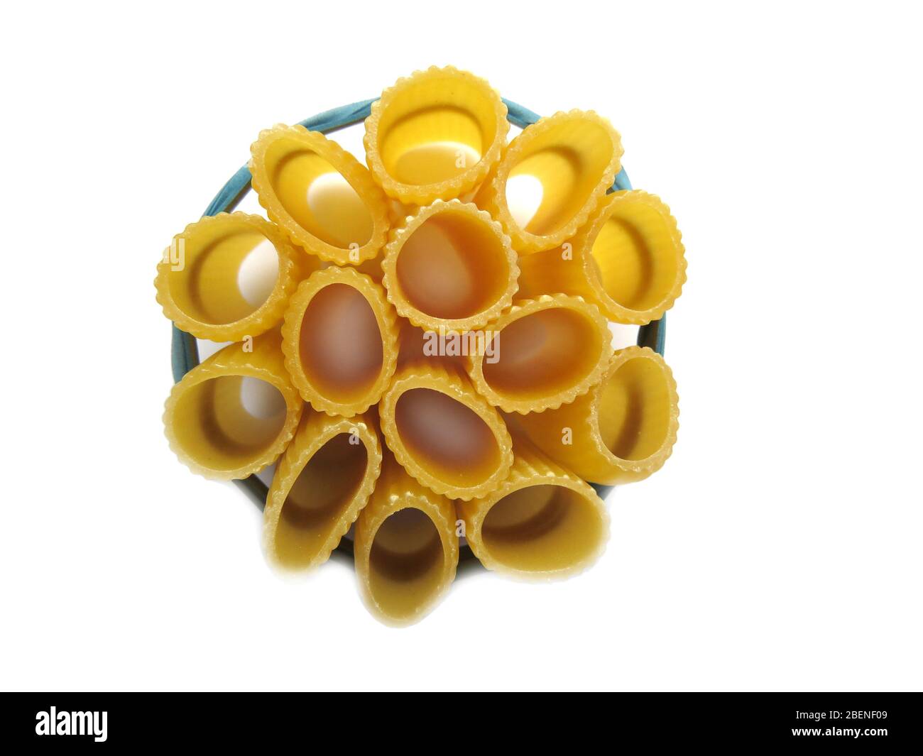 Round group of rigatoni dried pasta tied with an elastic on white Stock ...