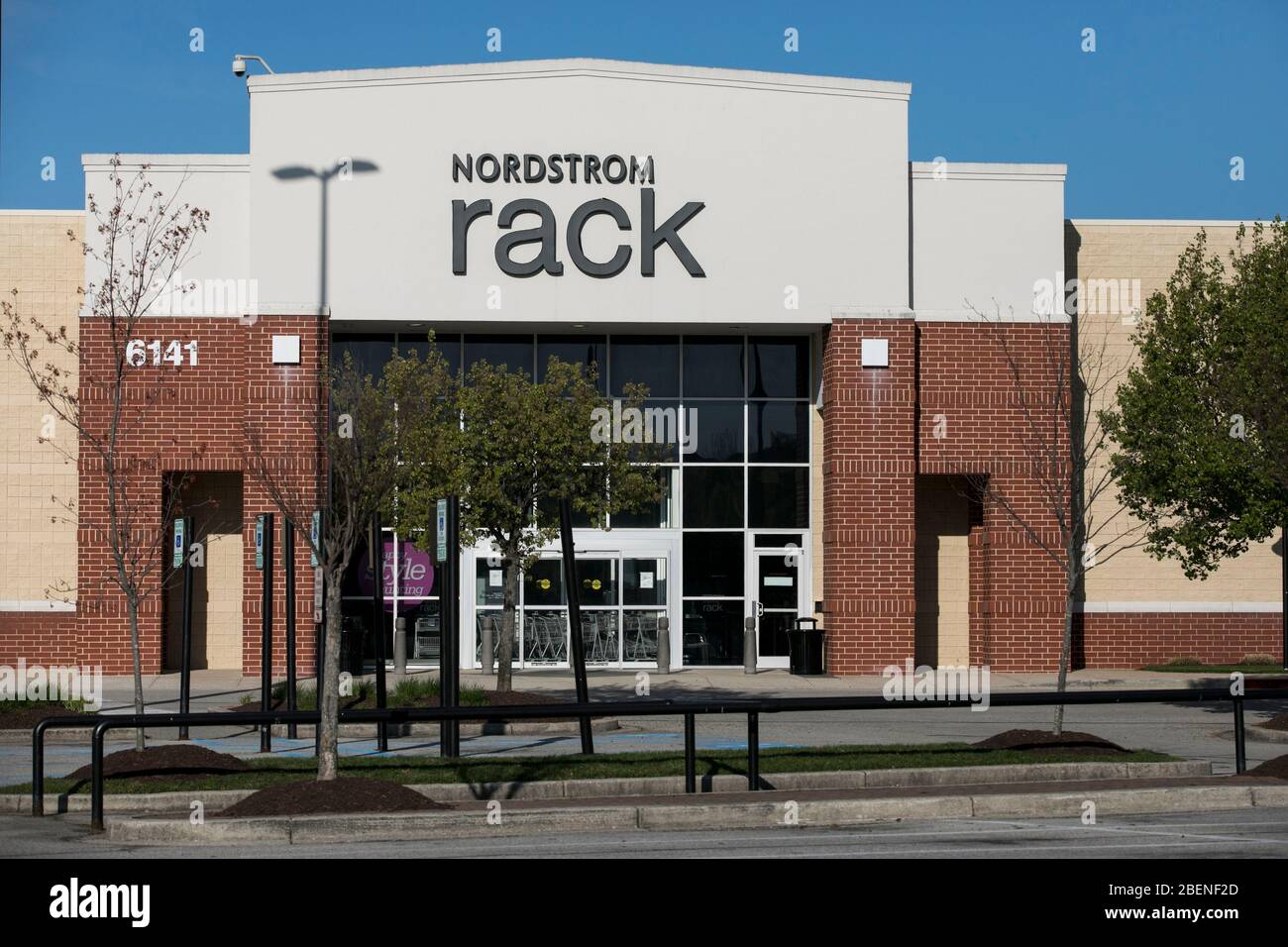 A logo sign outside of a Nordstrom Rack retail store location in ...