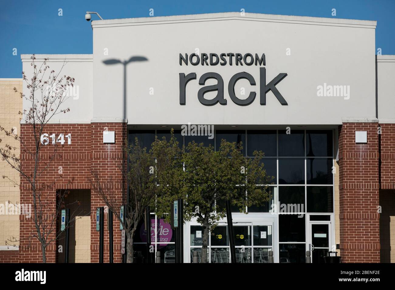 A logo sign outside of a Nordstrom Rack retail store location in ...