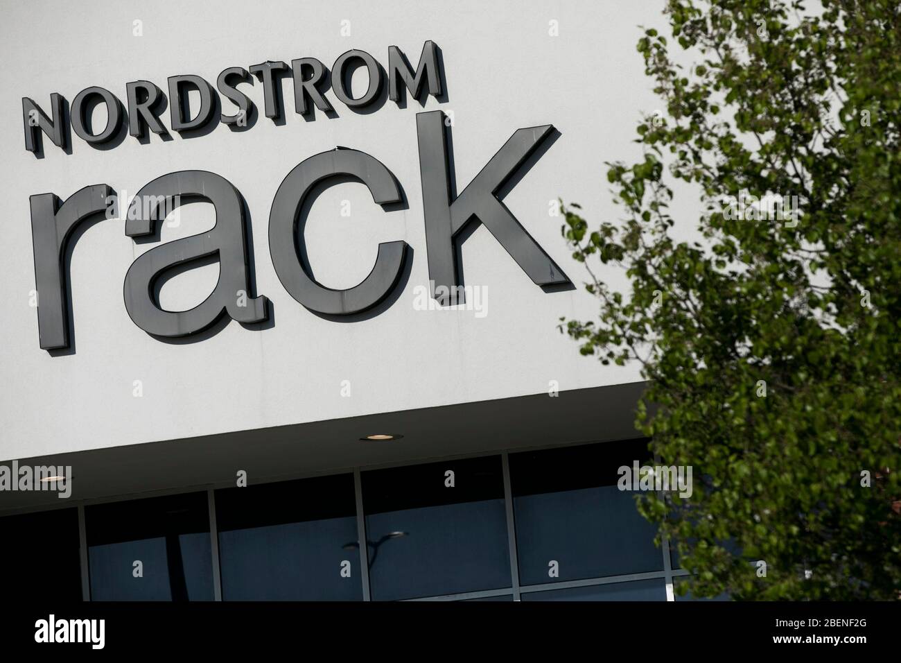 A logo sign outside of a Nordstrom Rack retail store location in ...