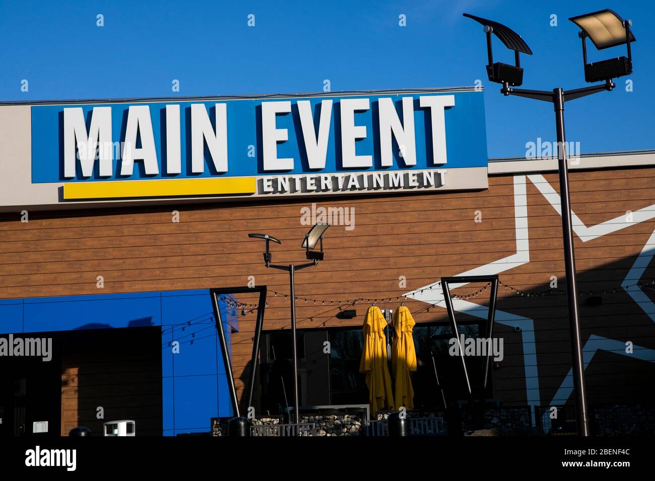 A logo sign outside of a Main Event Entertainment location in Columbia ...