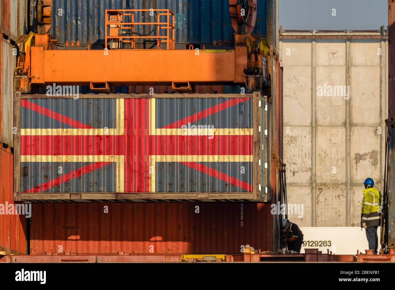 Unloading a container with the flag of Great Britain aboard a container ...