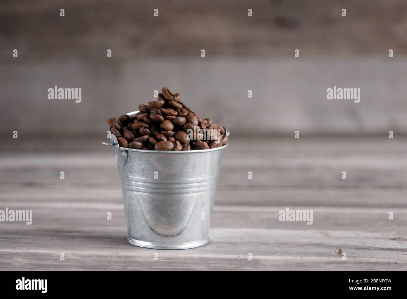Bucket and scoop of coffee beans on burlap sack Stock Photo - Alamy