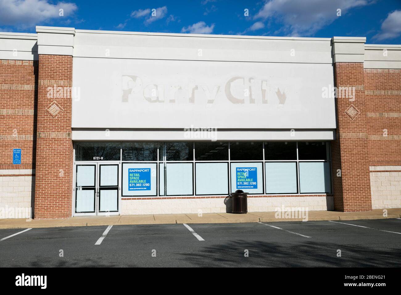 The faded outline of a logo sign outside of a closed and abandoned ...