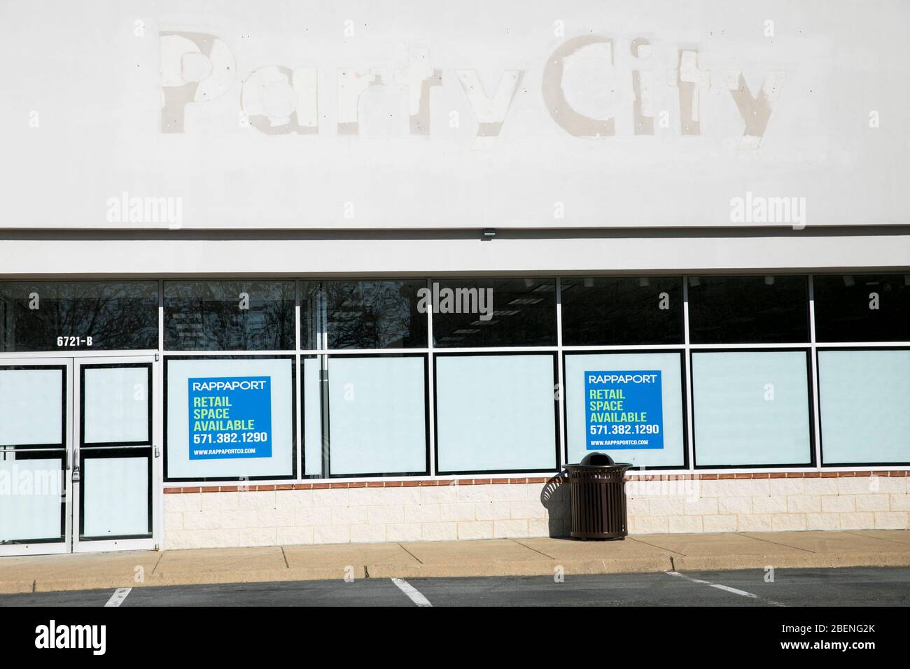 The faded outline of a logo sign outside of a closed and abandoned ...