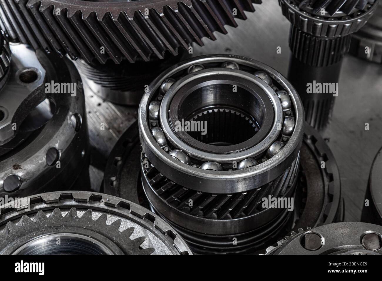 Close-up device of a complex transport mechanism. Metallic shiny gears ...