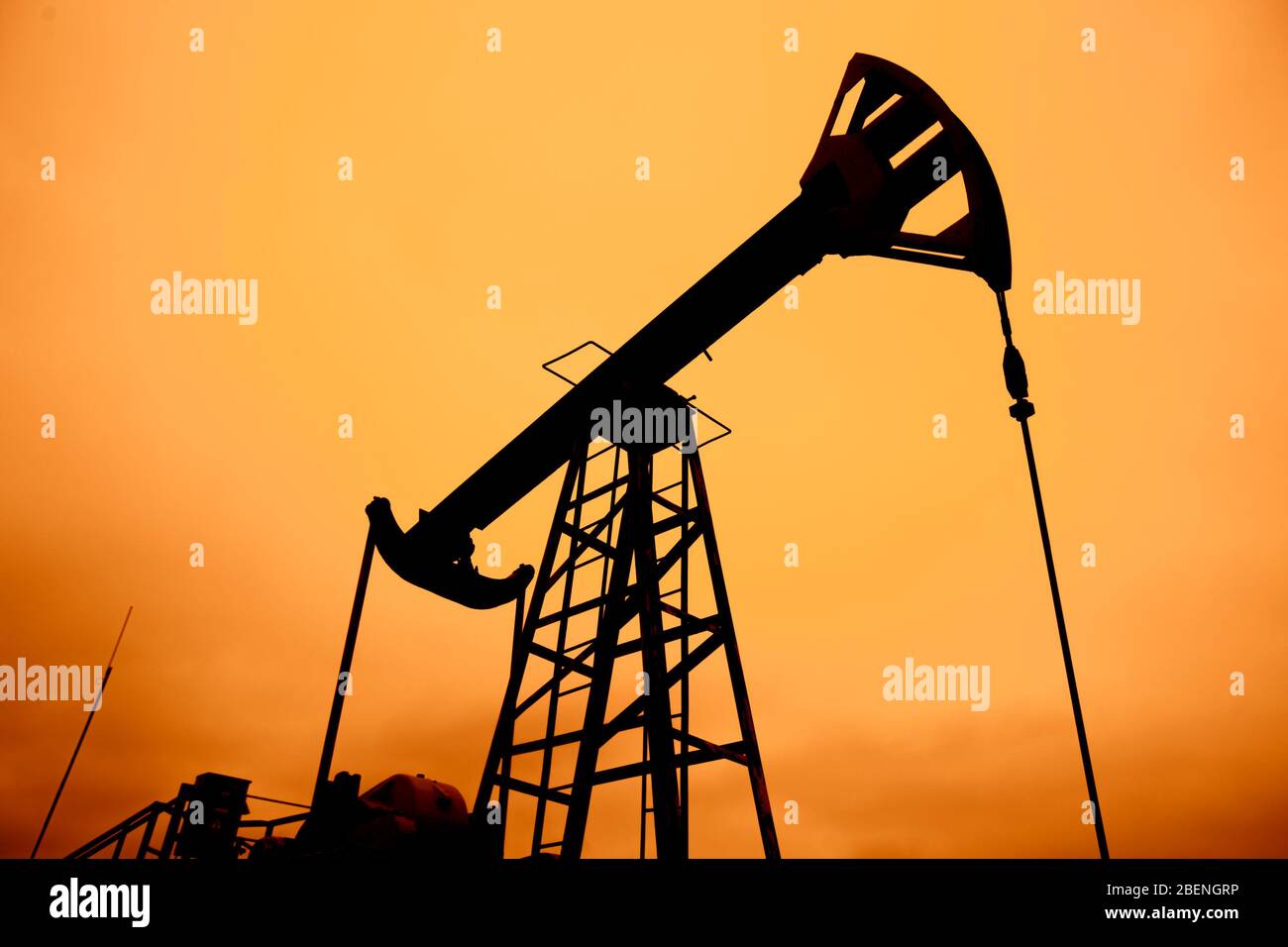 Oil pump oil rig energy industrial machine for petroleum in the sunset ...