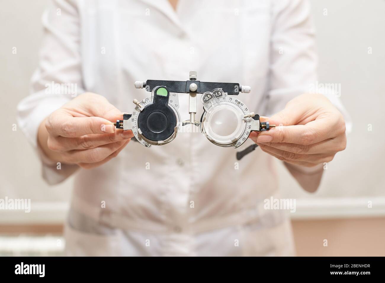 ophthalmologist doctor in exam optician laboratory with female patient ...