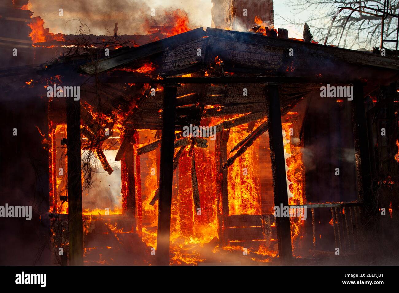 Firefighters trying to save burning house Stock Photo - Alamy