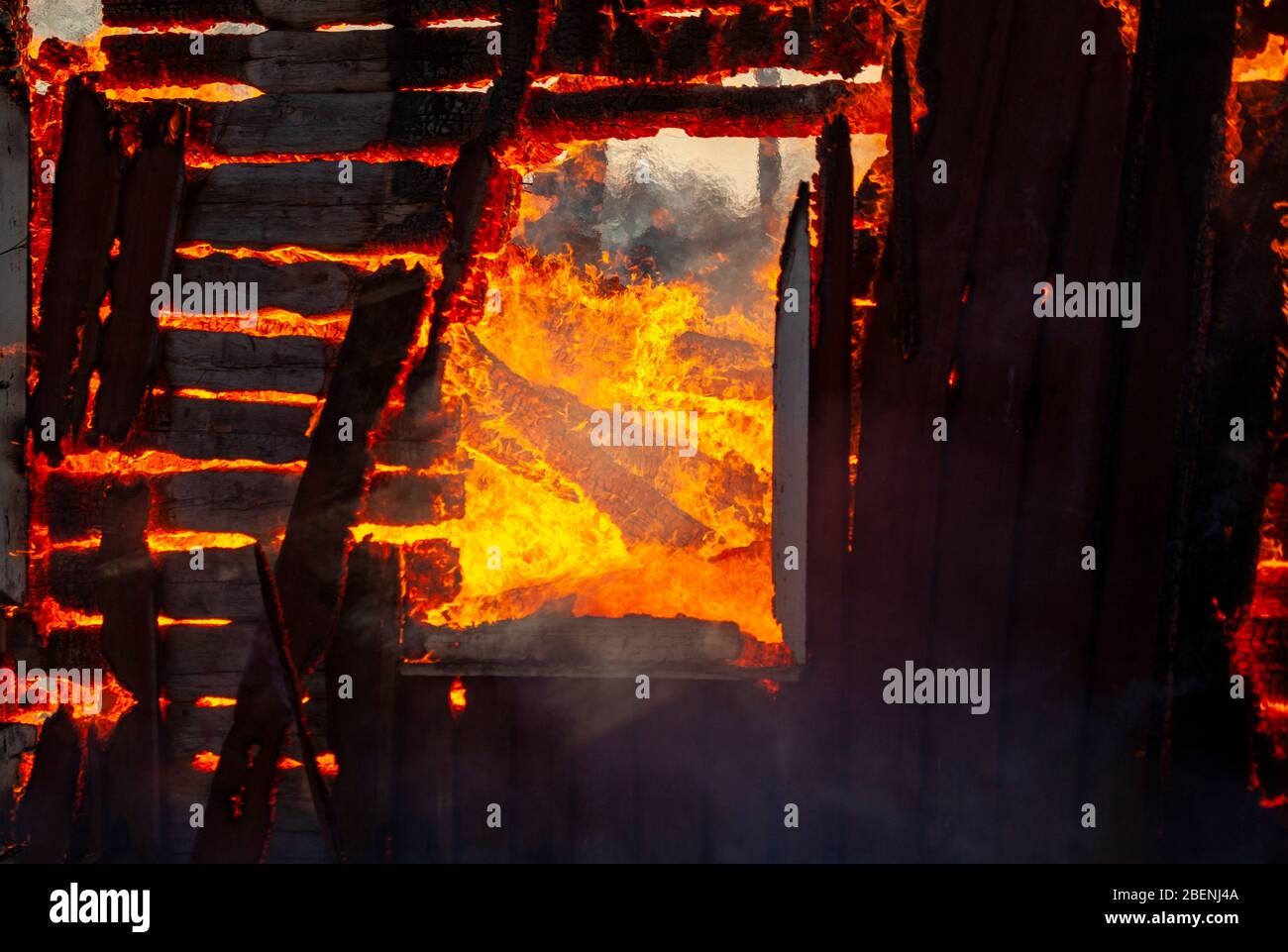 Firefighters trying to save burning house Stock Photo - Alamy