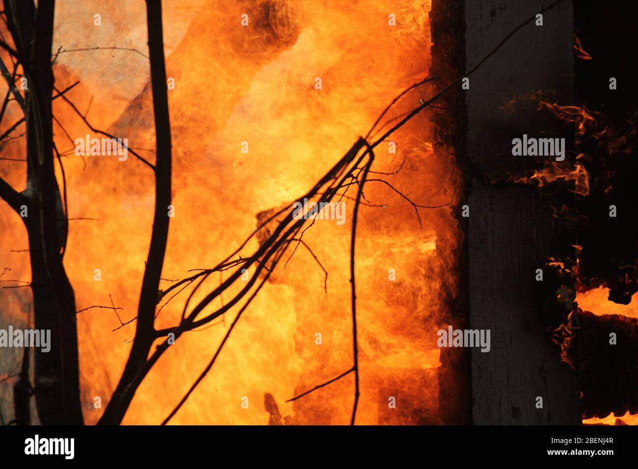 Firefighters trying to save burning house Stock Photo - Alamy