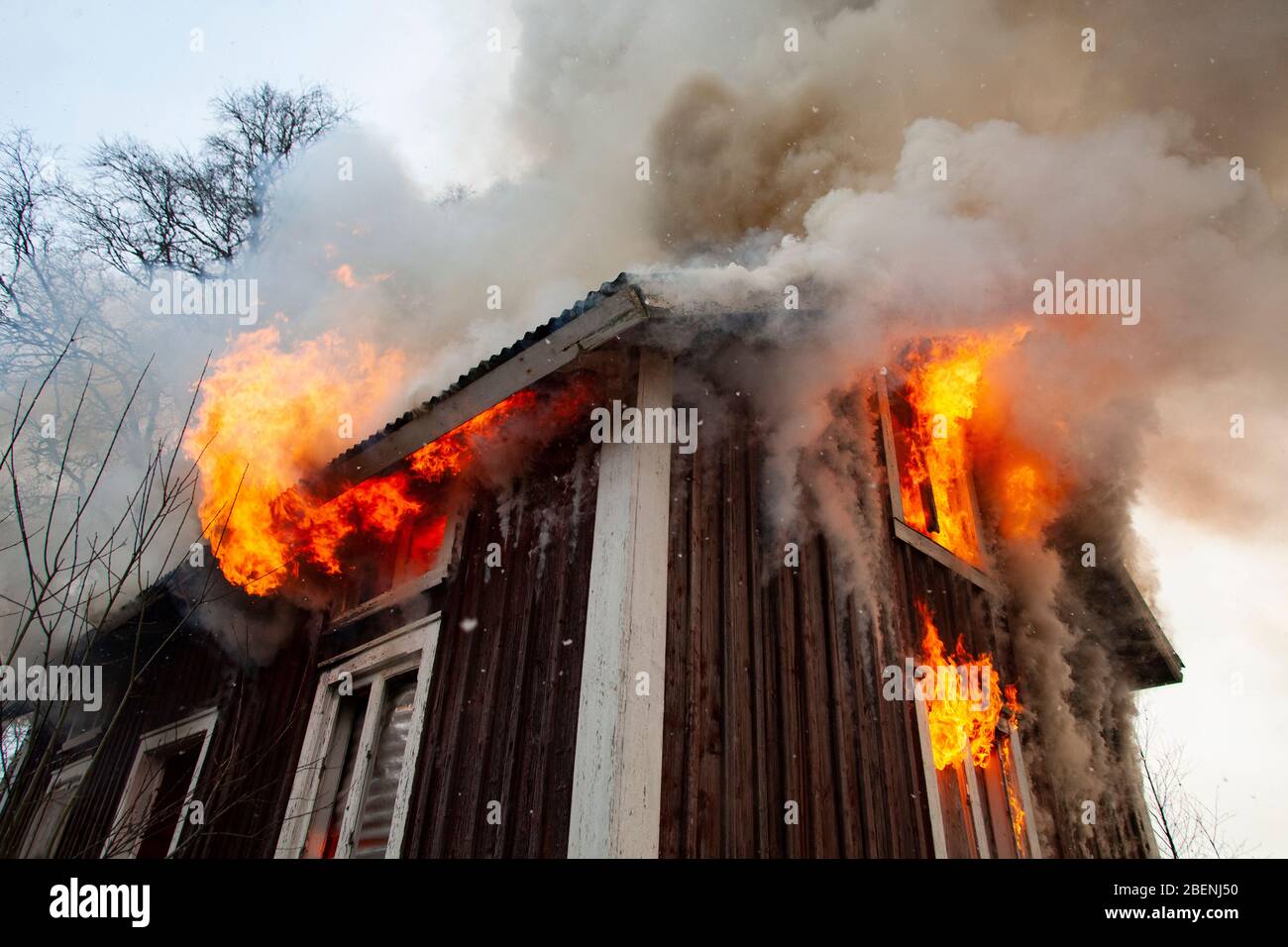 Firefighters trying to save burning house Stock Photo - Alamy