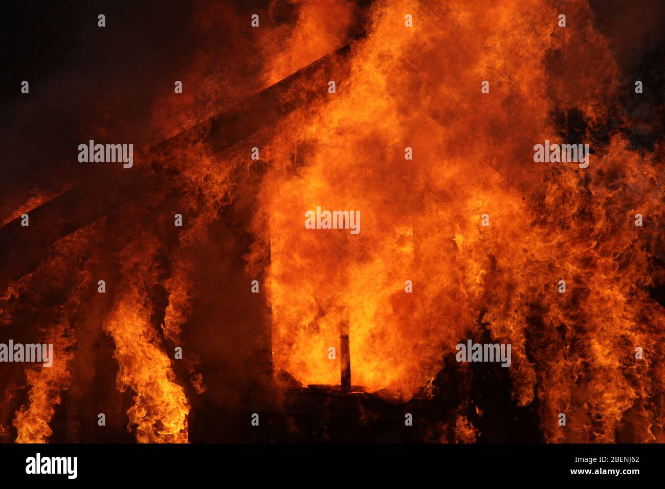 Firefighters trying to save burning house Stock Photo - Alamy