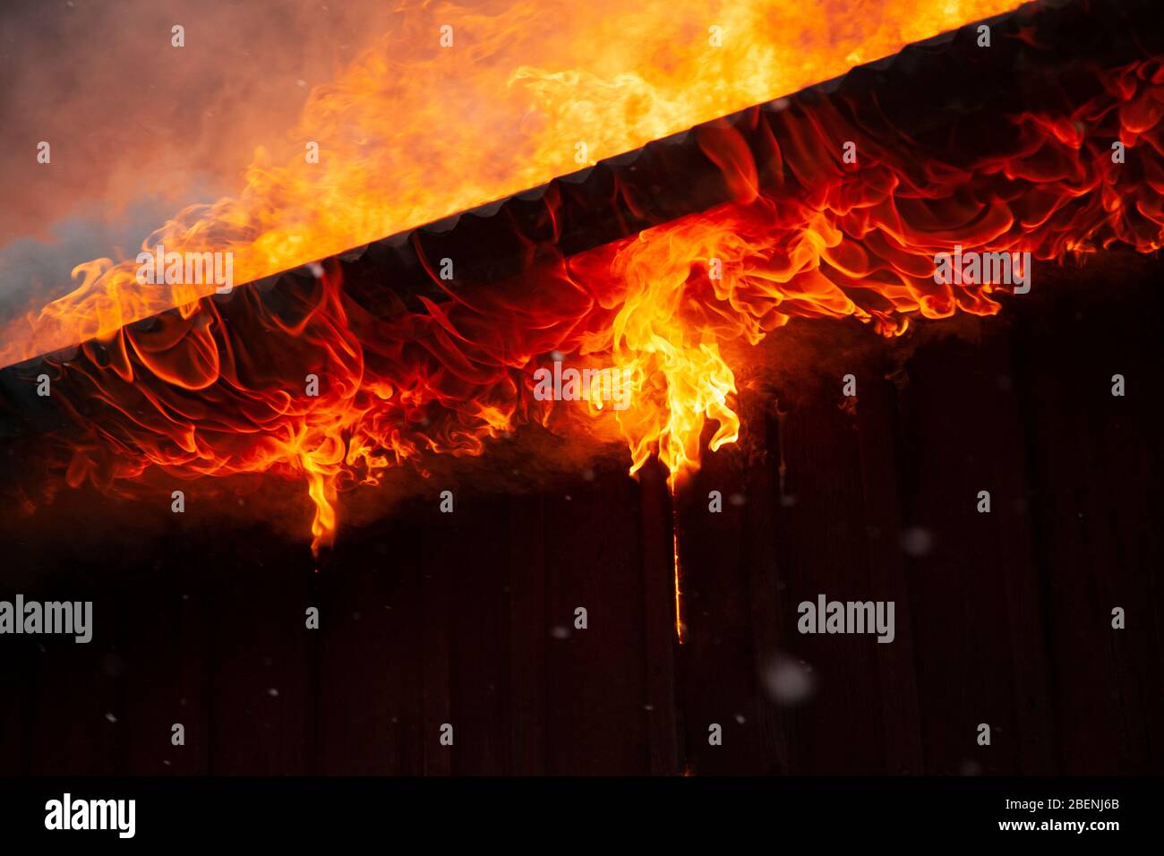 Firefighters trying to save burning house Stock Photo - Alamy