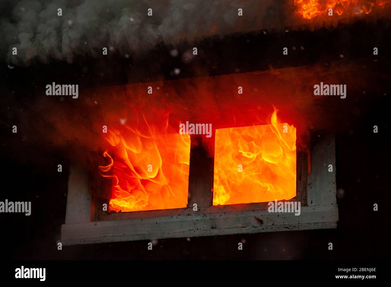 Firefighters trying to save burning house Stock Photo - Alamy