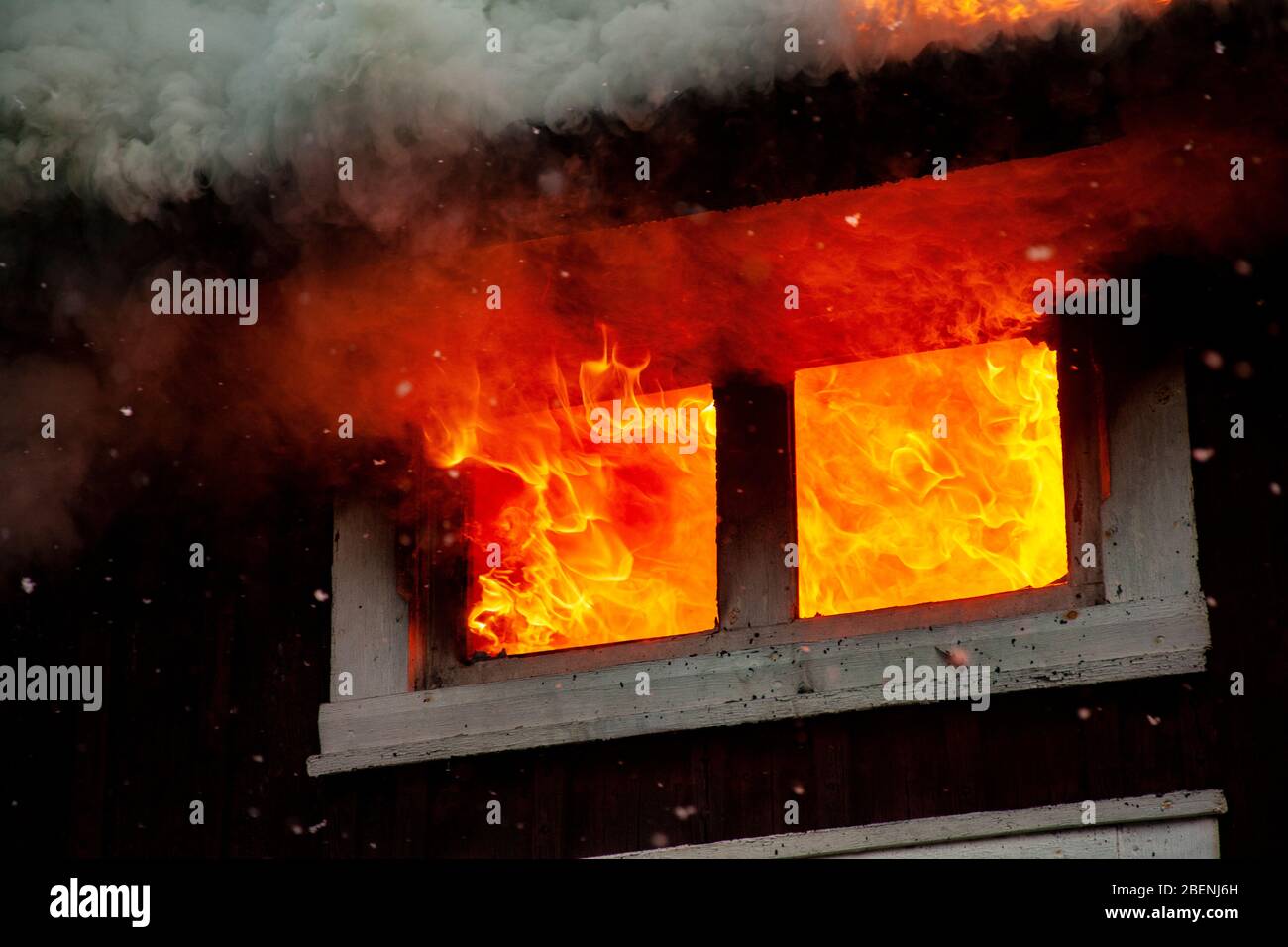 Firefighters trying to save burning house Stock Photo - Alamy