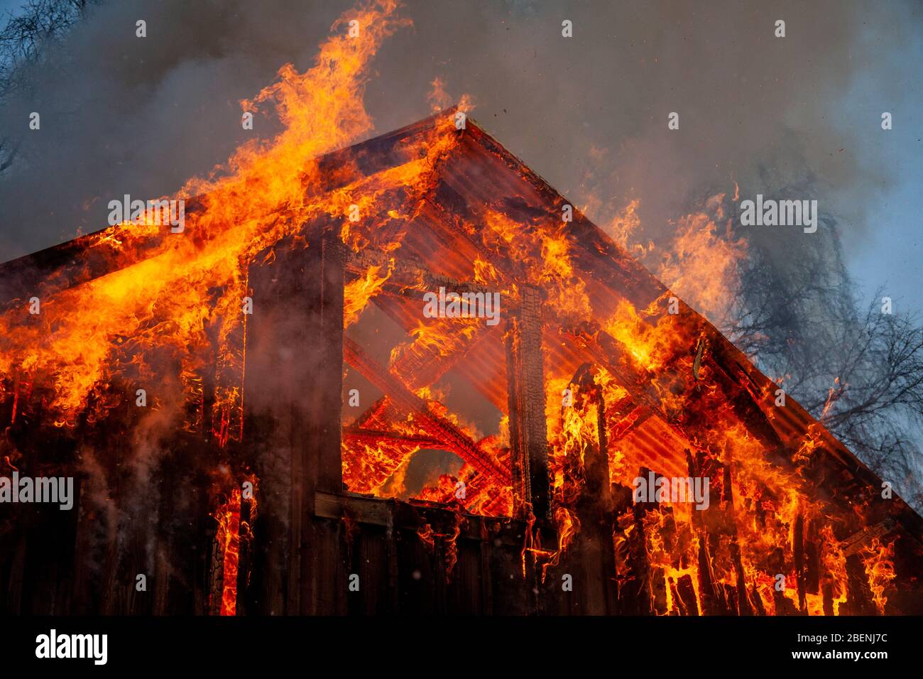 Firefighters trying to save burning house Stock Photo - Alamy