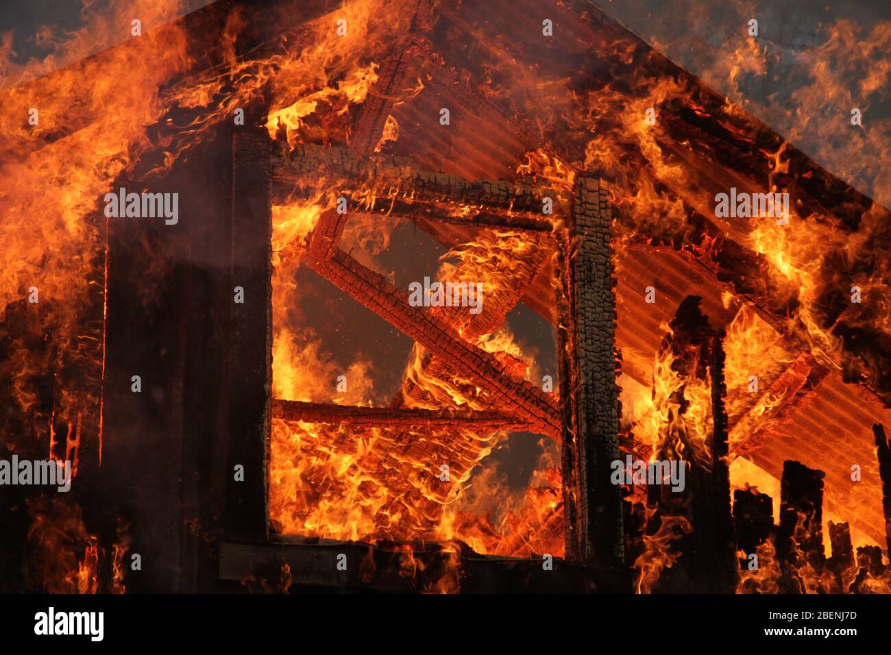 Firefighters trying to save burning house Stock Photo - Alamy