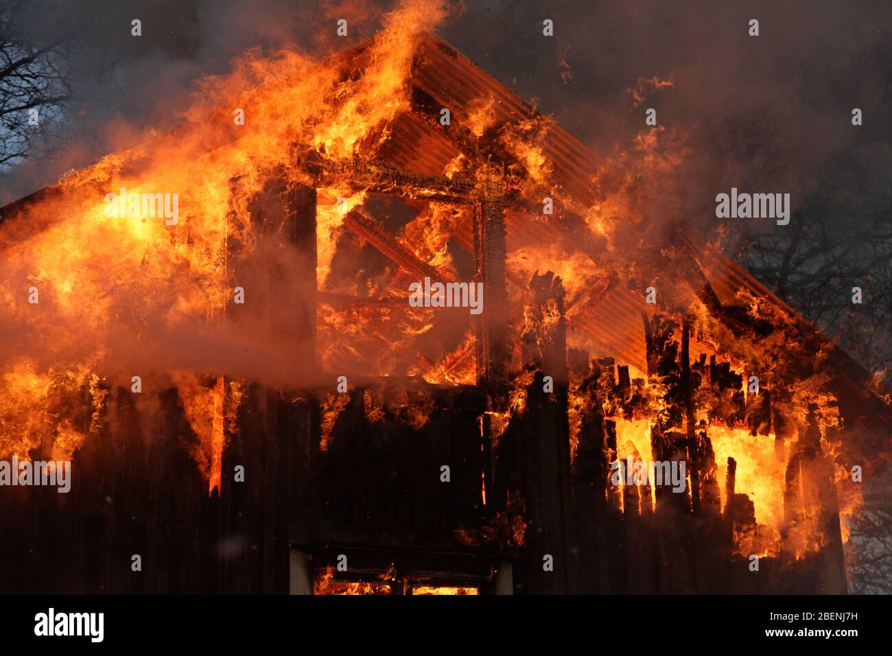 Firefighters trying to save burning house Stock Photo - Alamy