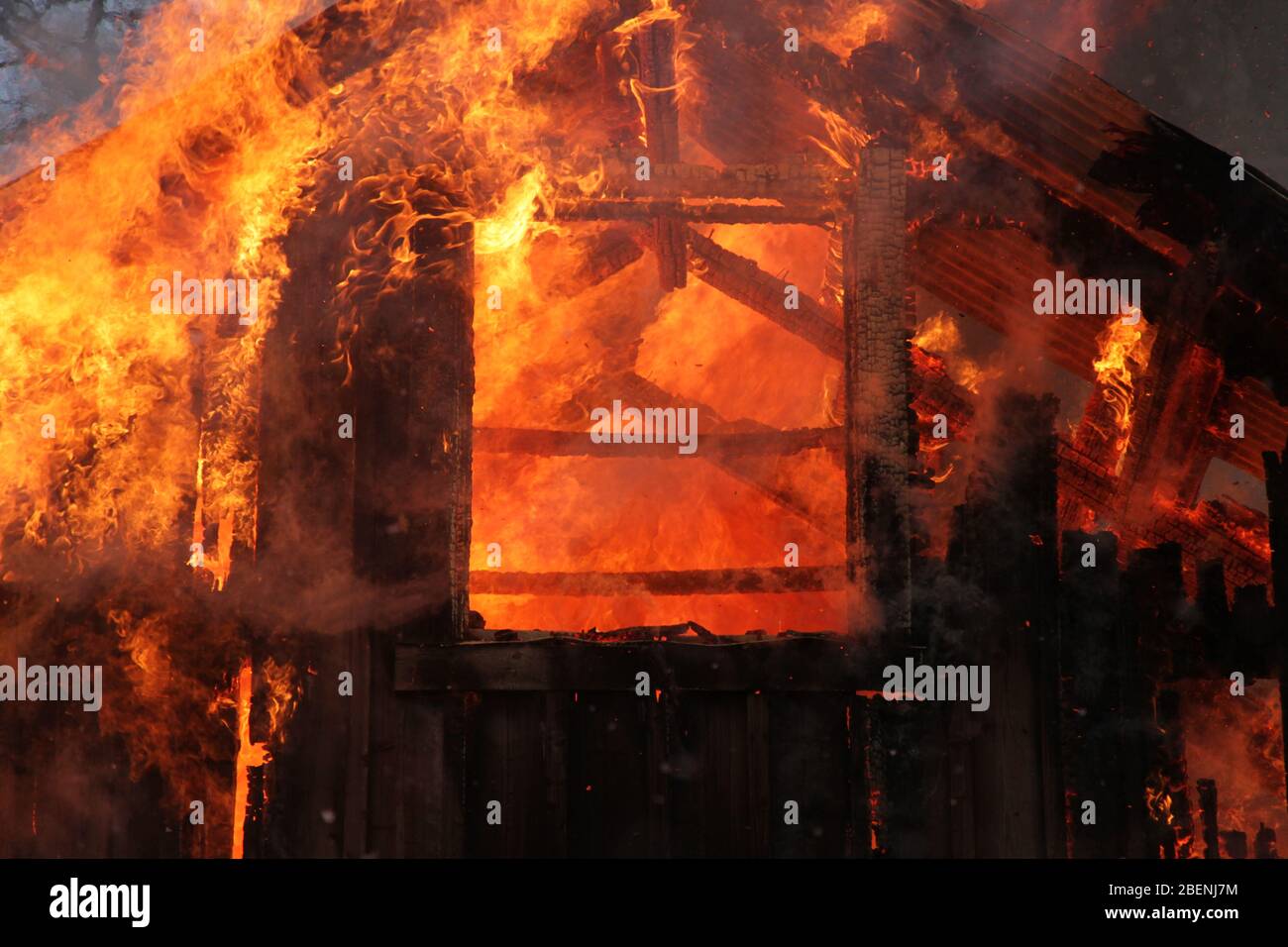 Firefighters trying to save burning house Stock Photo - Alamy
