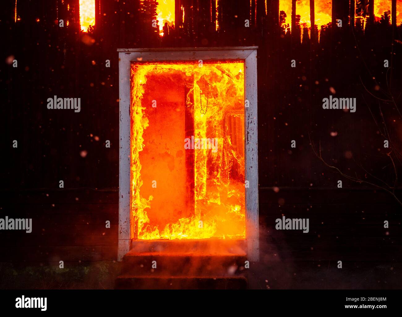 Firefighters trying to save burning house Stock Photo - Alamy