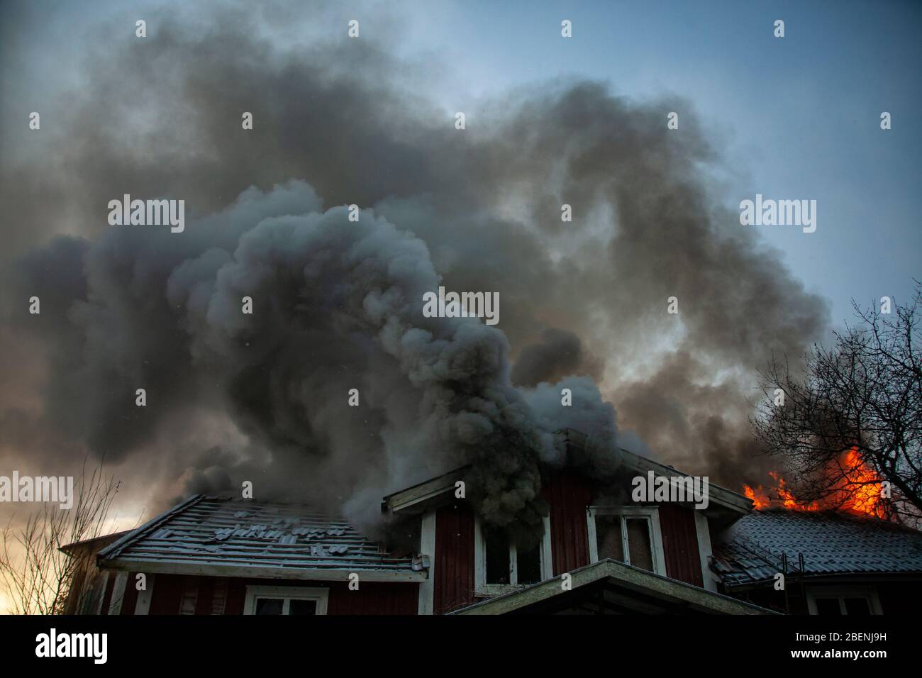 Firefighters trying to save burning house Stock Photo - Alamy