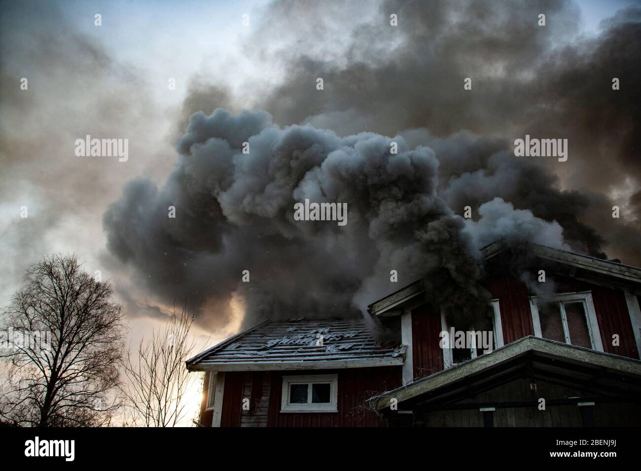 Firefighters trying to save burning house Stock Photo - Alamy