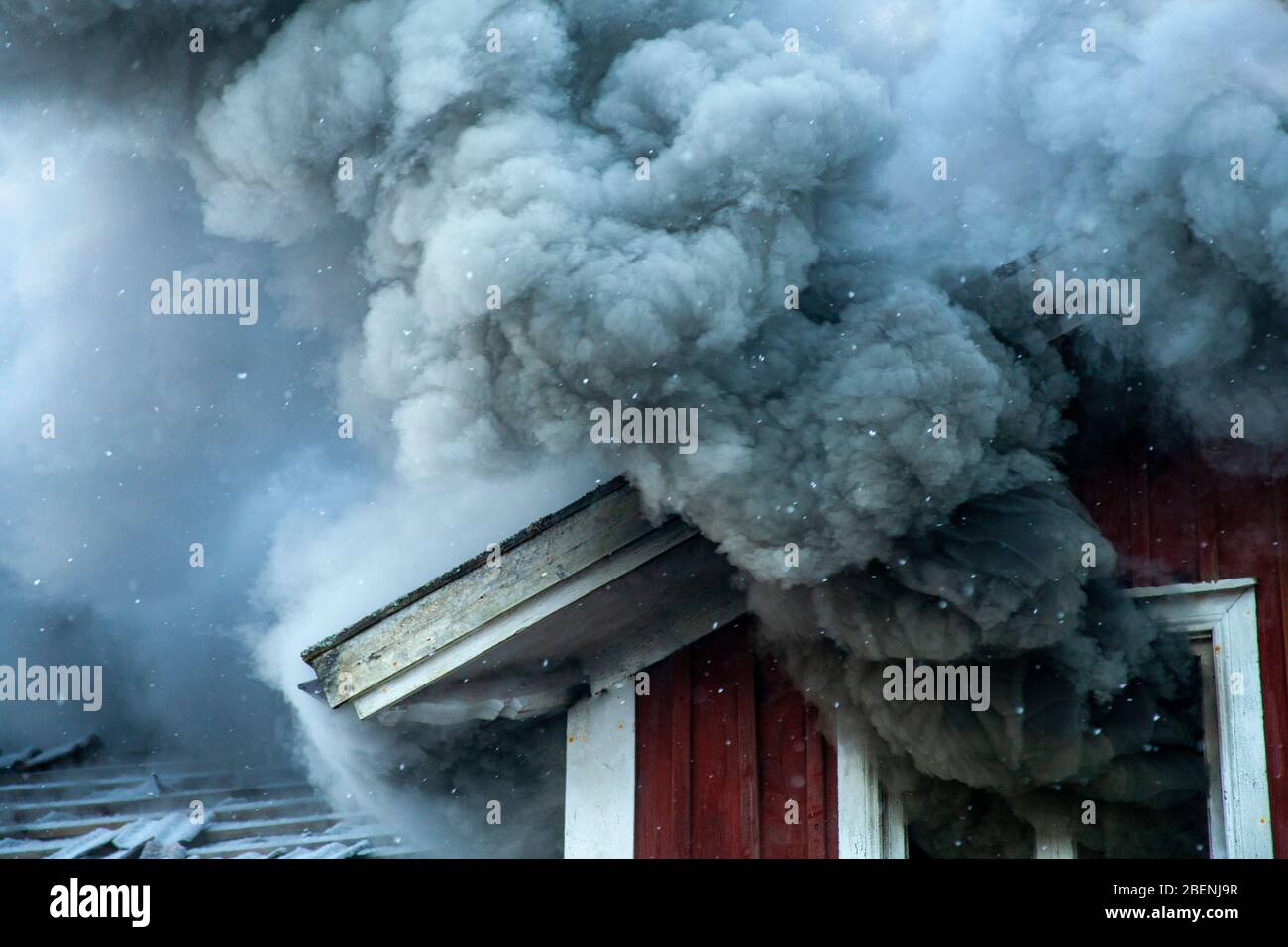 Firefighters trying to save burning house Stock Photo - Alamy