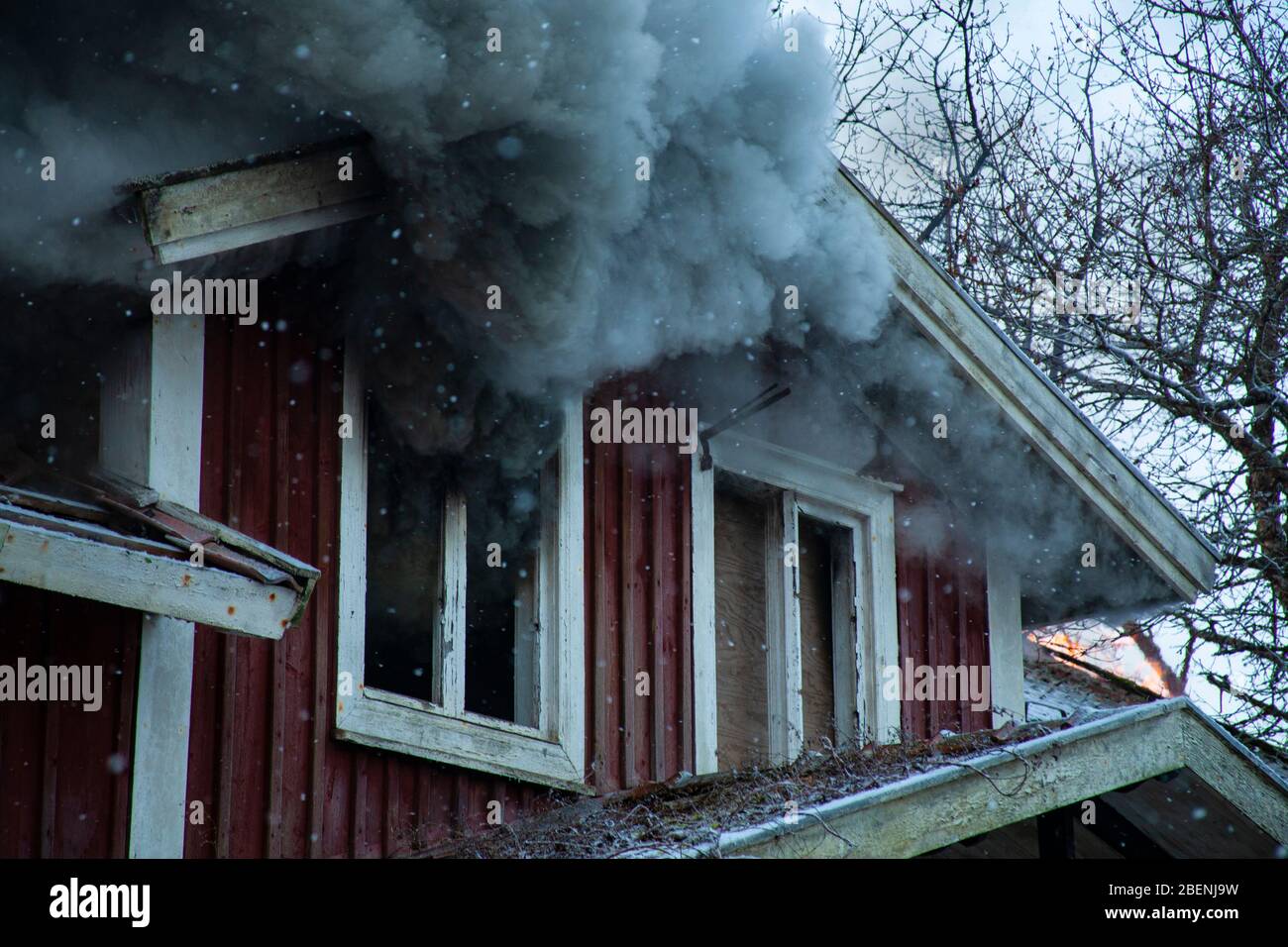 Firefighters trying to save burning house Stock Photo - Alamy