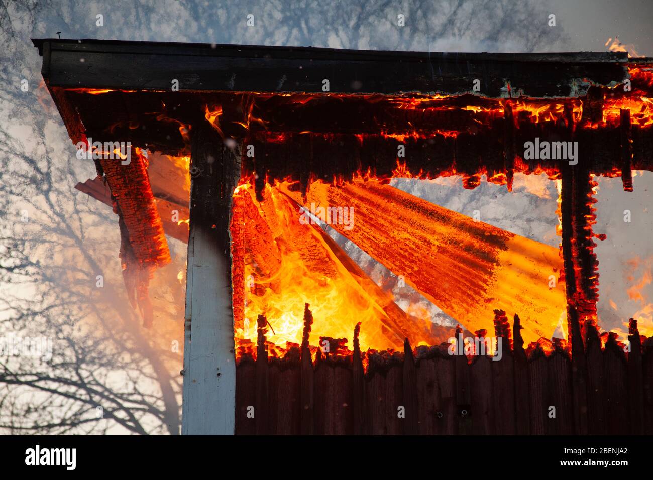Firefighters trying to save burning house Stock Photo - Alamy