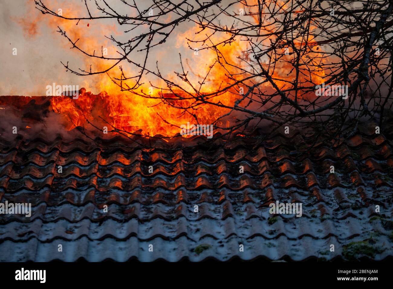 Firefighters trying to save burning house Stock Photo - Alamy